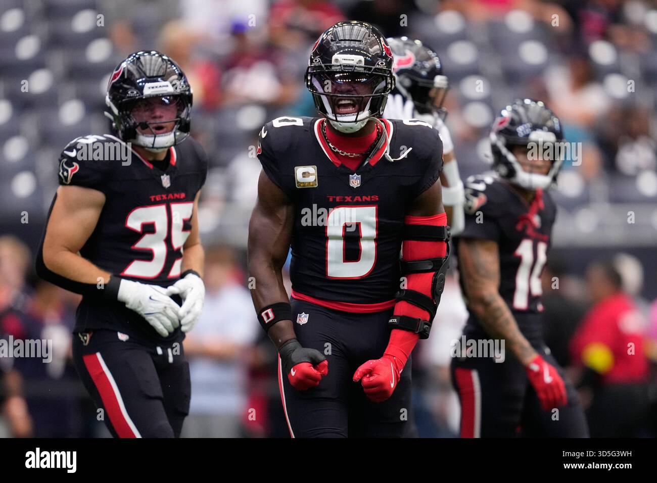 Houston Texans linebacker Azeez Al-Shaair warms up before an NFL ...