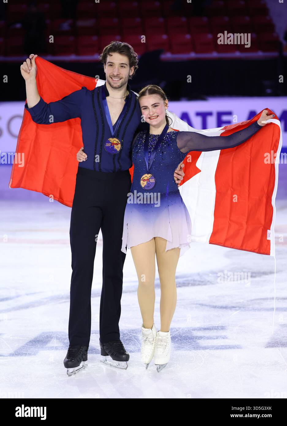 Kelly Ann LAURIN and Loucas ETHIER of Canada pose for photos after a ...