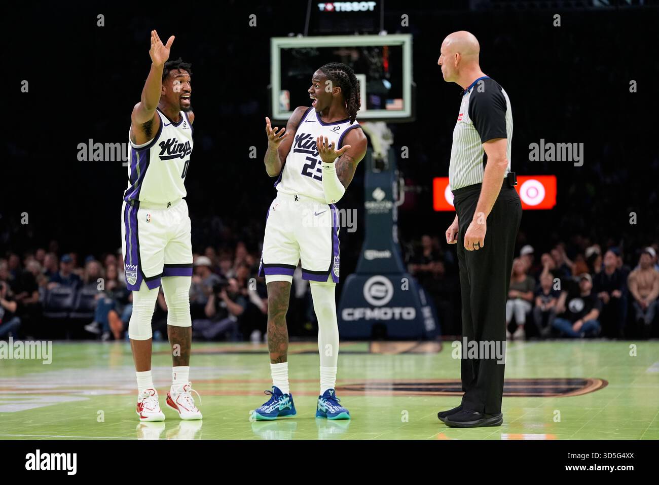 Sacramento Kings guards Malik Monk (0) and Keon Ellis (23) react next ...
