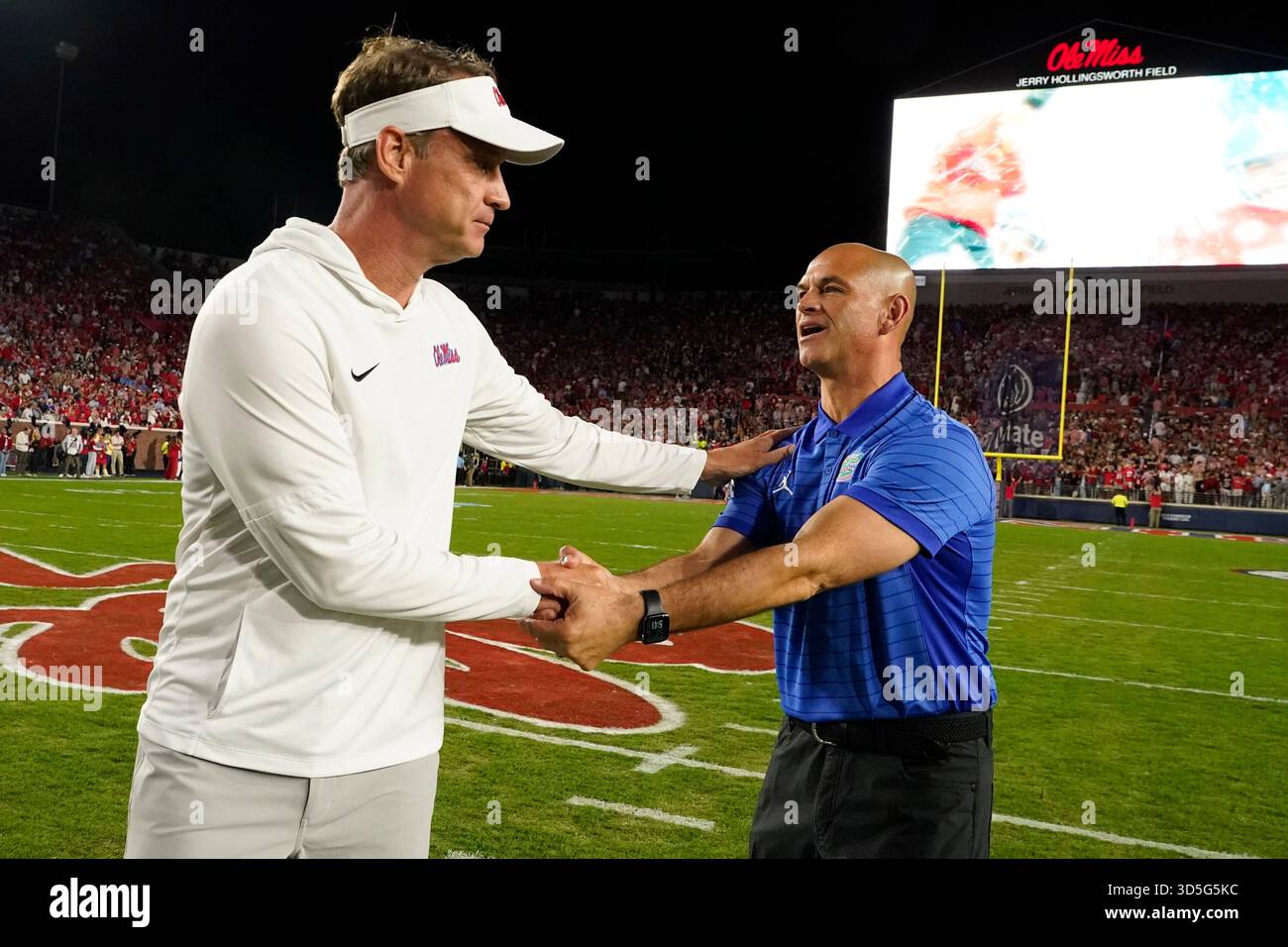 Mississippi head coach Lane Kiffin, left, and Florida interim head ...