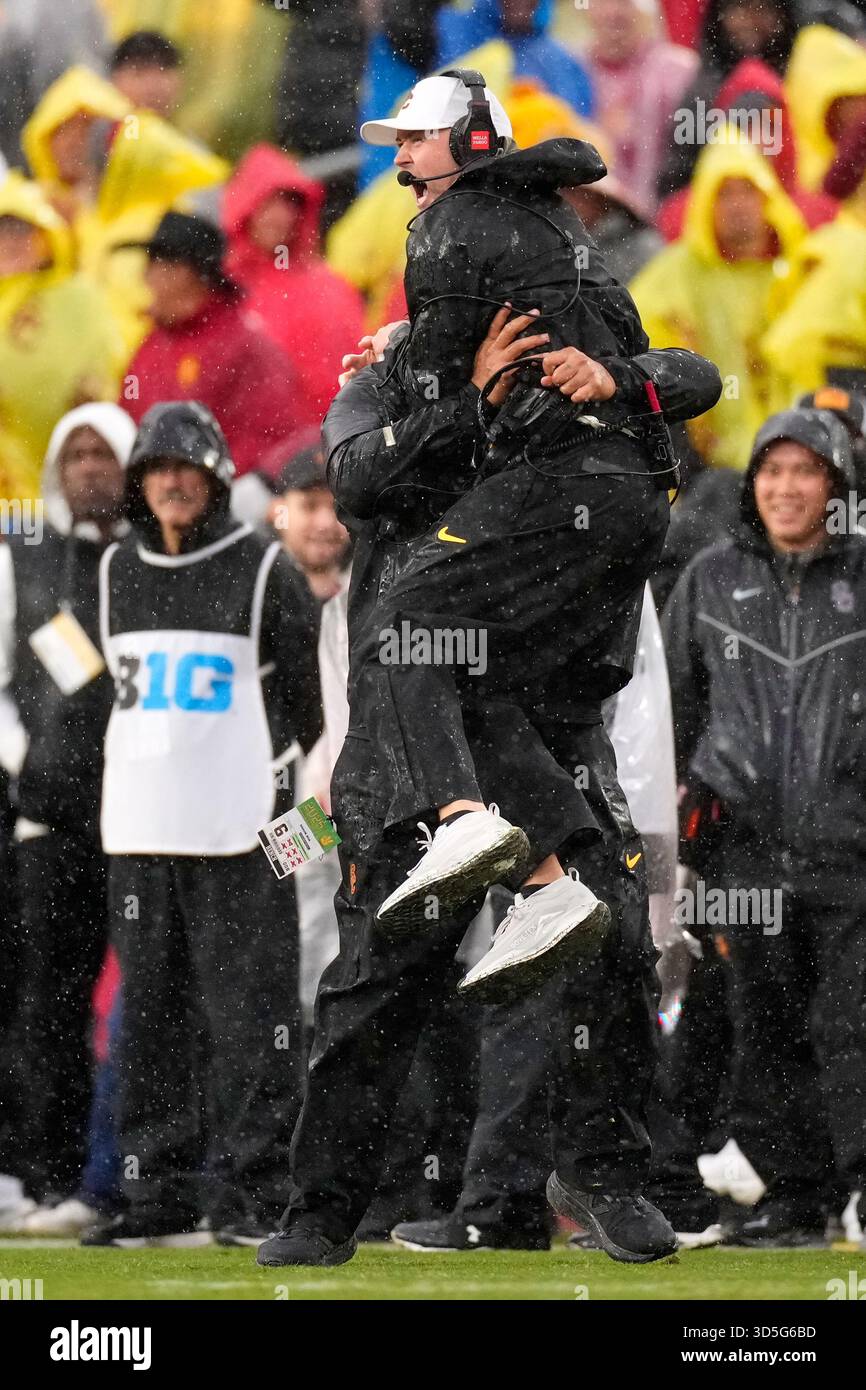 Southern California head coach Lincoln Riley, top, jumps into the arms ...