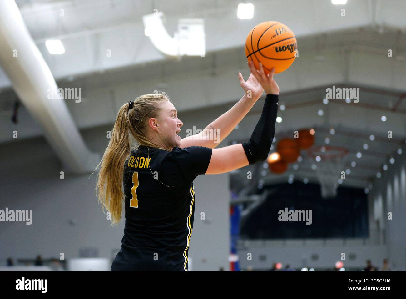 Michigan guard Olivia Olson (1) shoots during an NCAA basketball game ...