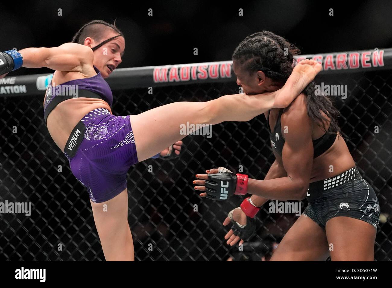 Fatima Kline, left, kicks Angela Hill during the third round of a women ...