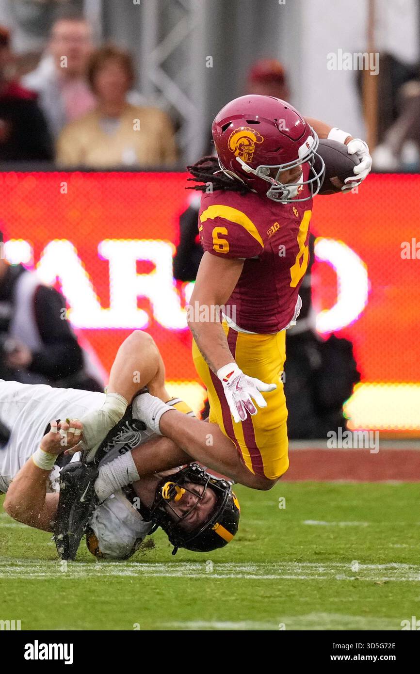 Southern California wide receiver Makai Lemon, right, is tackled by ...