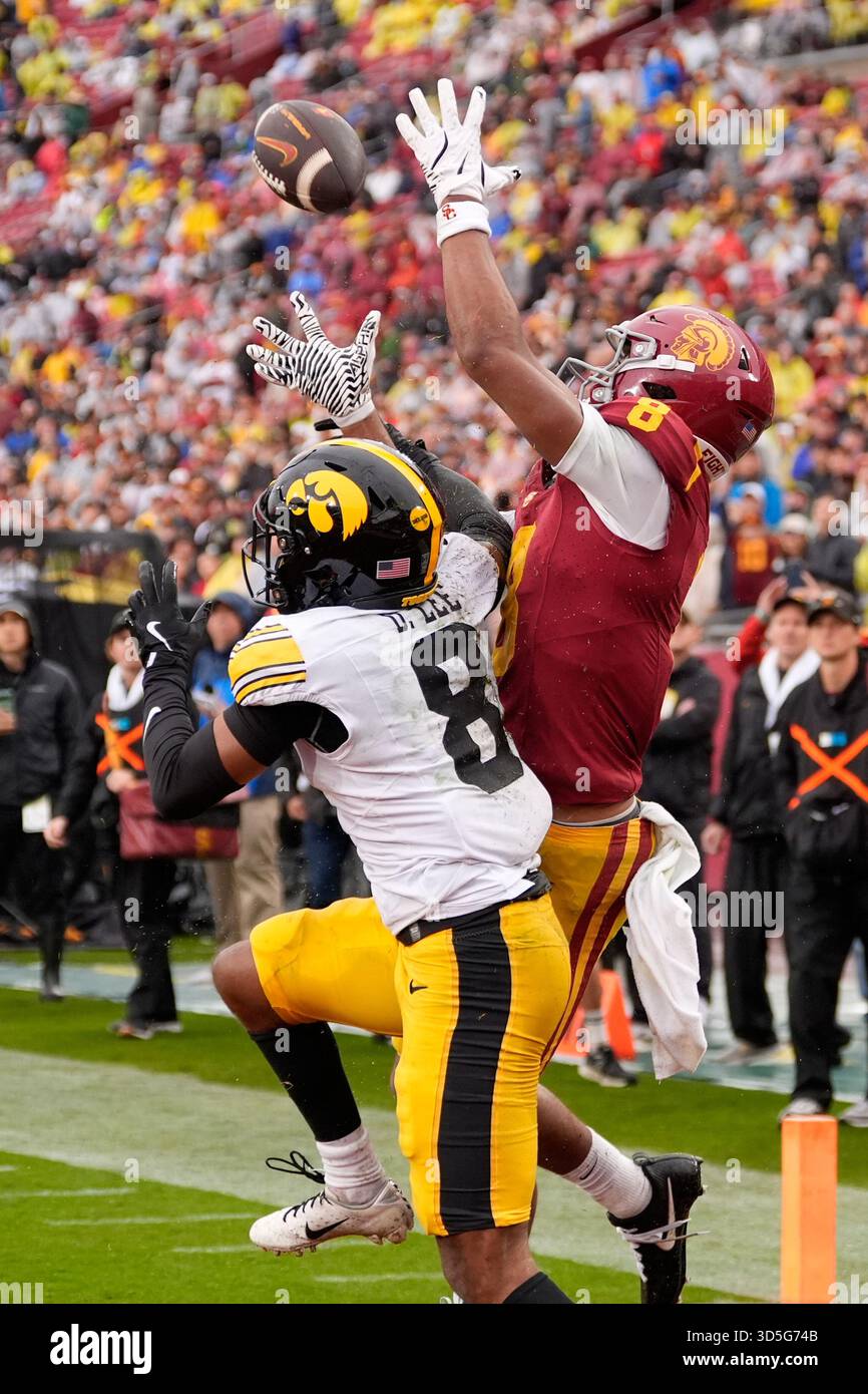 Iowa defensive back Deshaun Lee, left, breaks up a pass intended for ...
