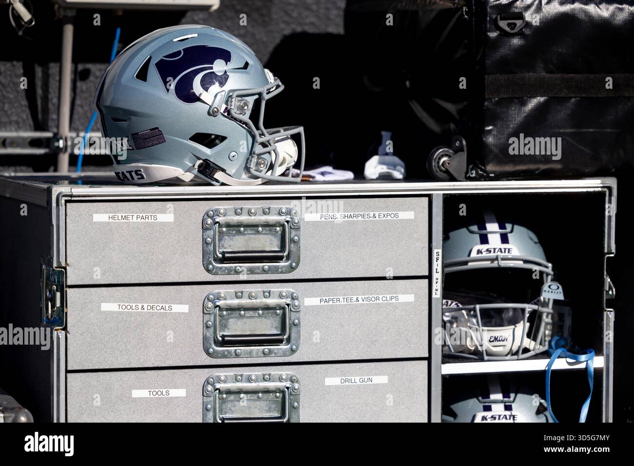 A Kansas State helmet sits on a equipment cart before an NCAA college ...