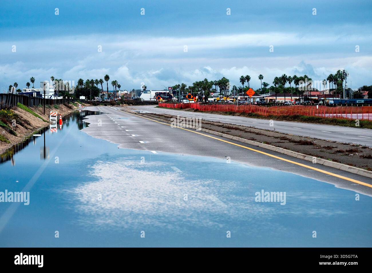 Water covers a stretch of Highway 1, which remained closed in both ...