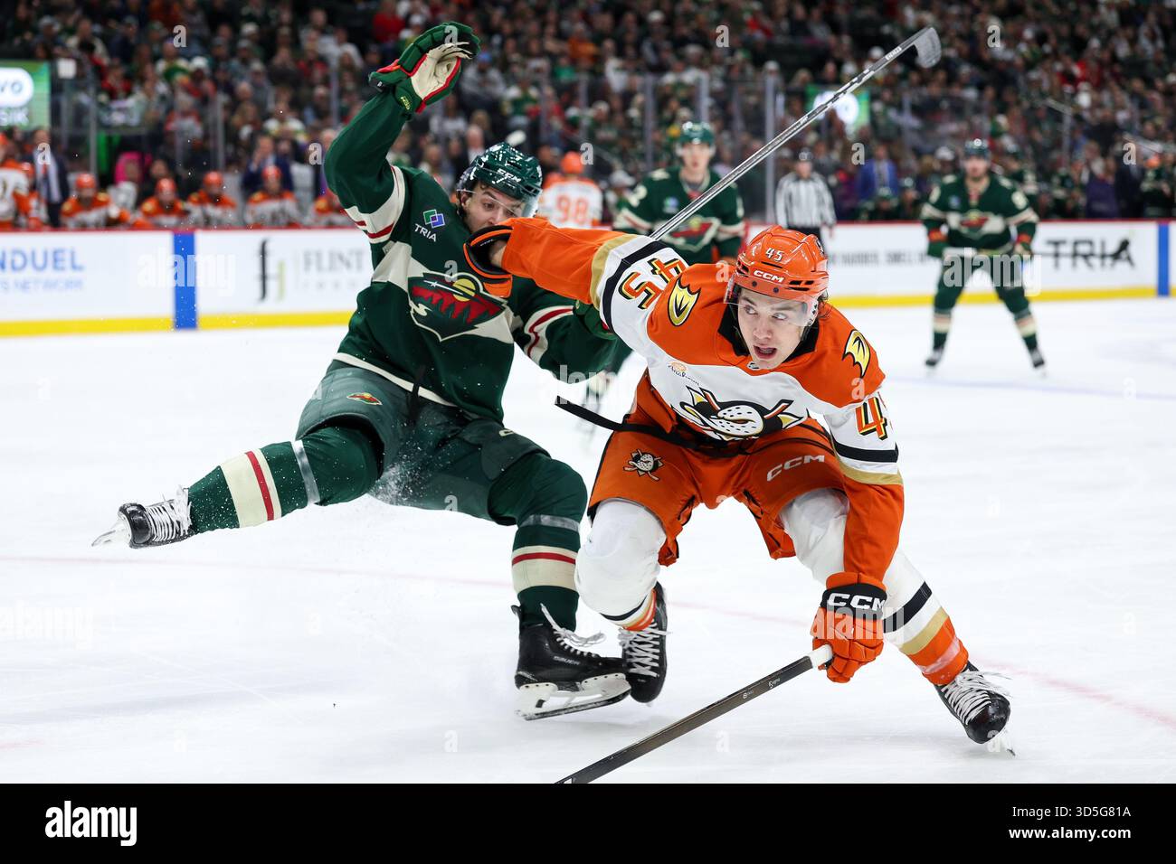 Anaheim Ducks right wing Beckett Sennecke, right, works passed ...