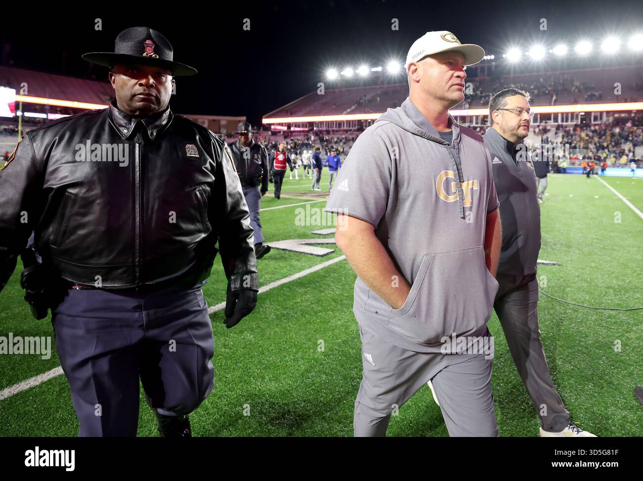 Georgia Tech head coach Brent Key, front right, walks off the field ...