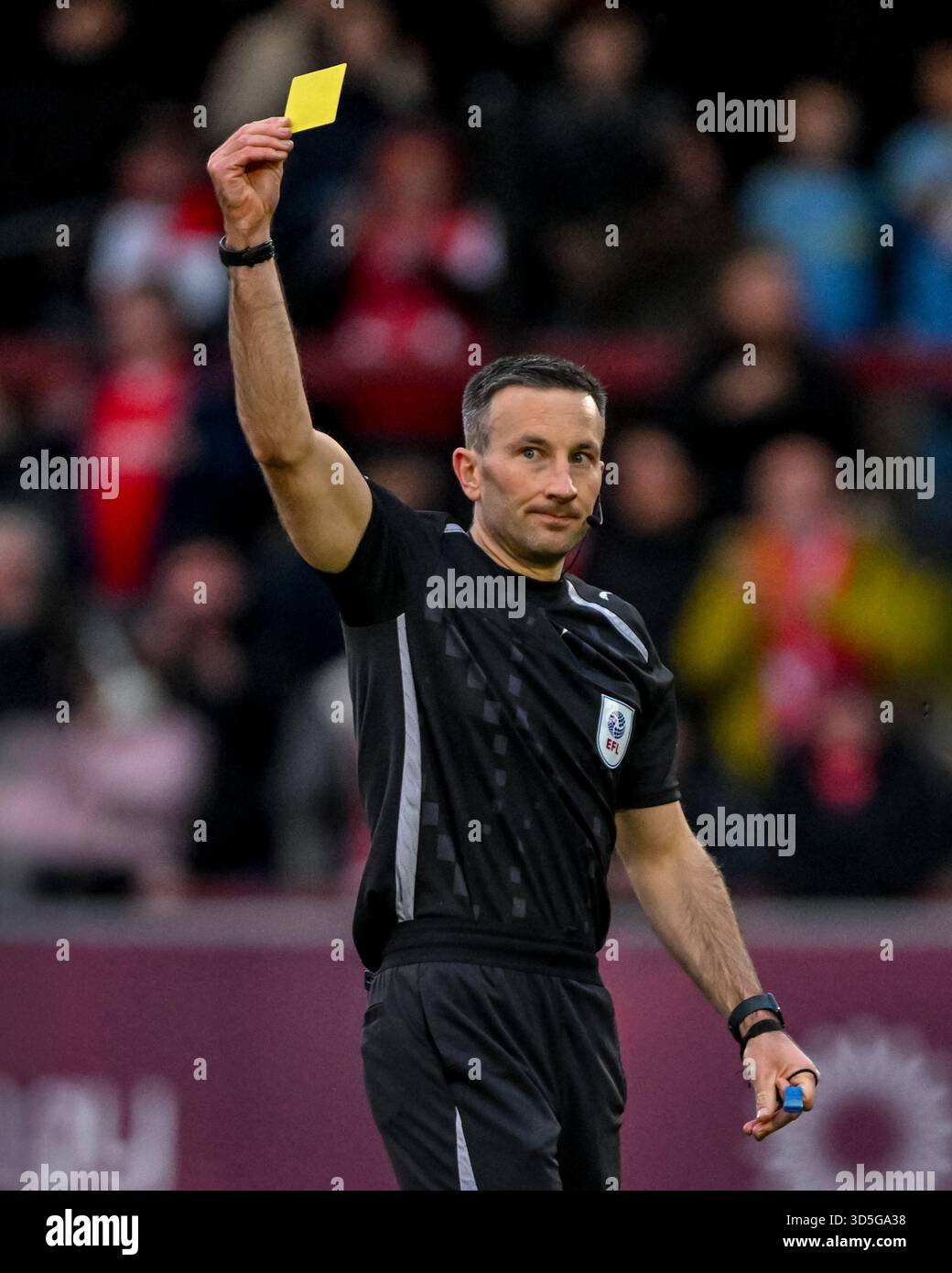 Referee Richard Eley showing a yellow card during the Sky Bet League 2 ...