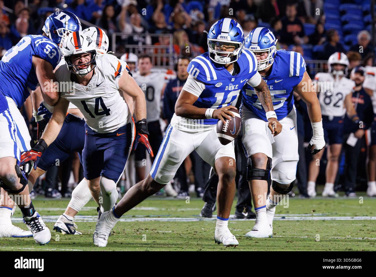 Duke's Darian Mensah (10) scrambles away from Virginia's Fisher Camac ...