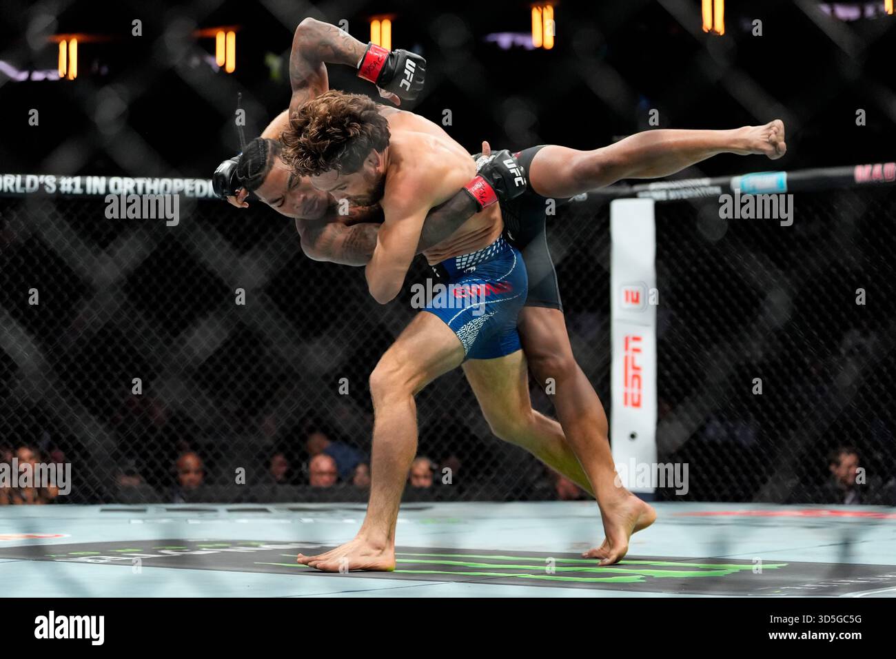 Malcolm Wellmaker grapples with Ethyn Ewing during the first round of a ...