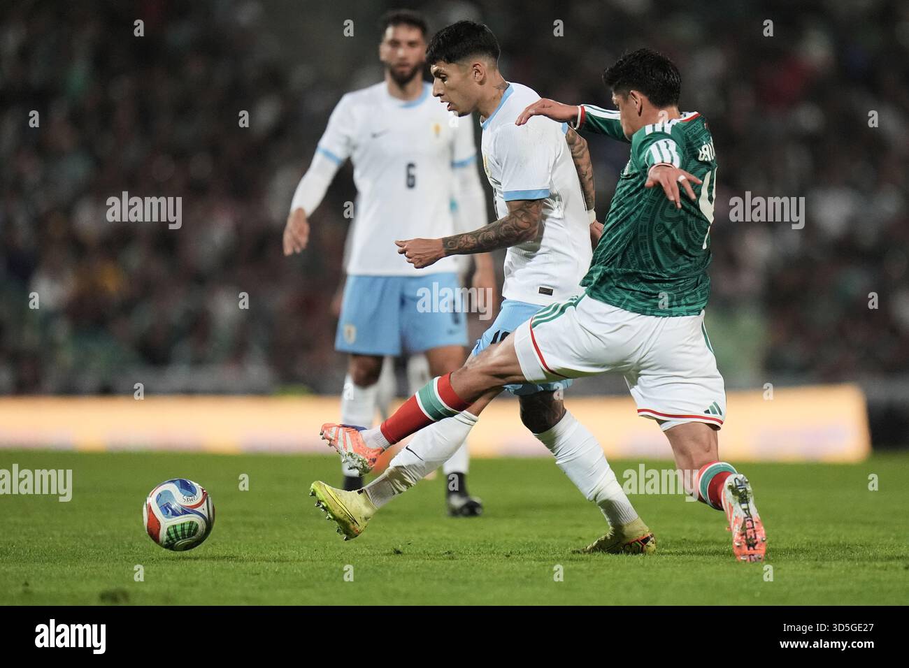 Mexico's Edson Álvarez, front, fouls Uruguay's Mathías Olivera during ...