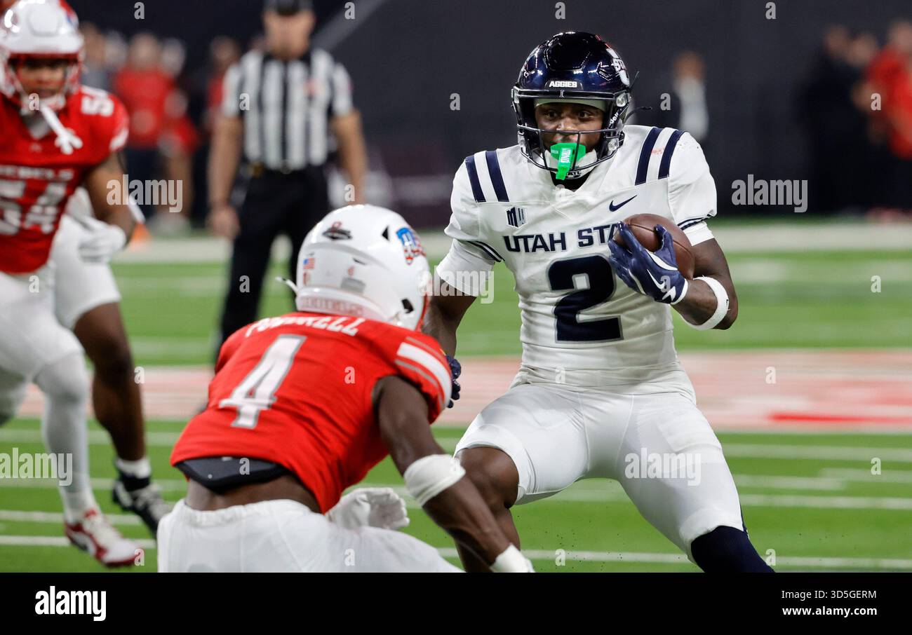 Utah State running back Miles Davis (2) carries the ball against UNLV ...