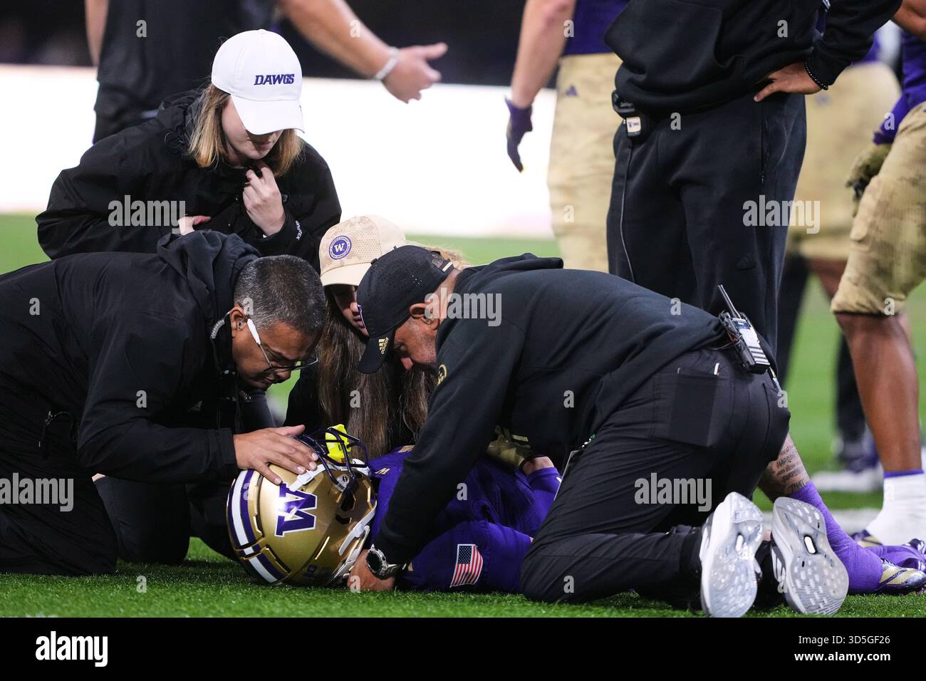 Washington staff examine Washington wide receiver Raiden Vines-Bright ...