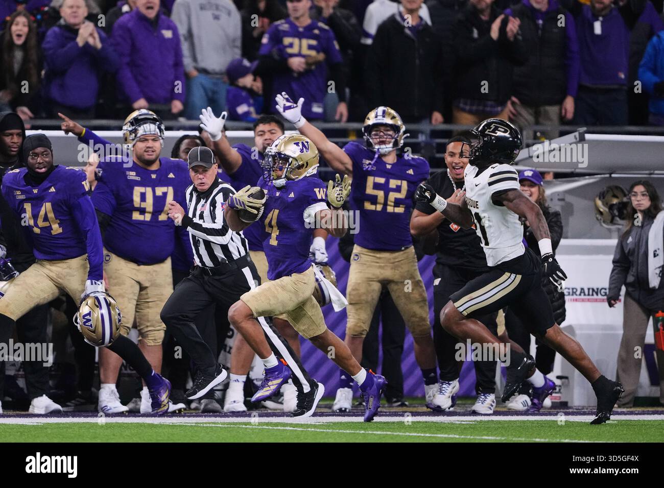 Washington running back Jordan Washington (4) escapes Purdue defensive ...