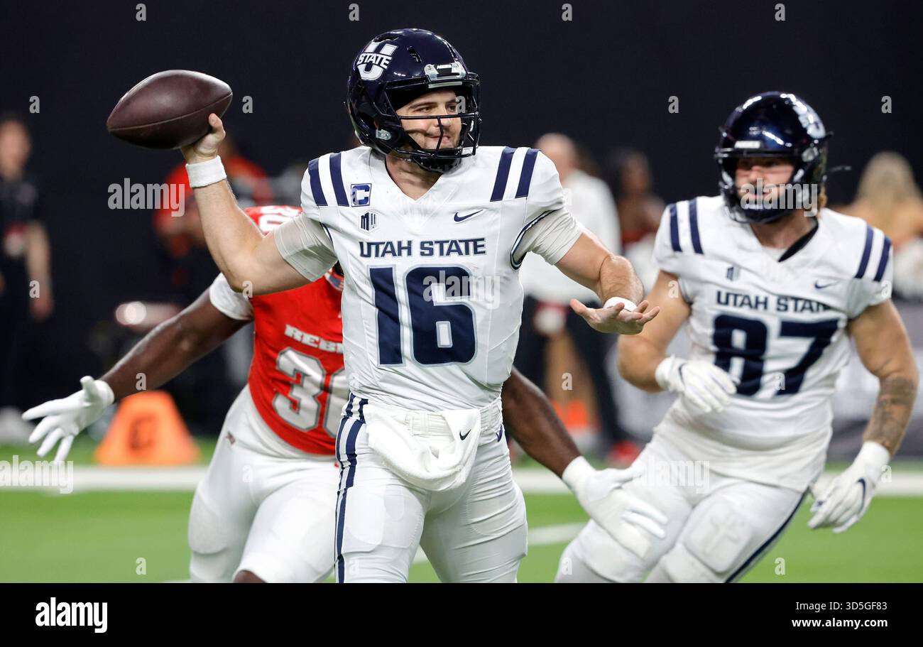 Utah State quarterback Bryson Barnes (16) passes under pressure from ...
