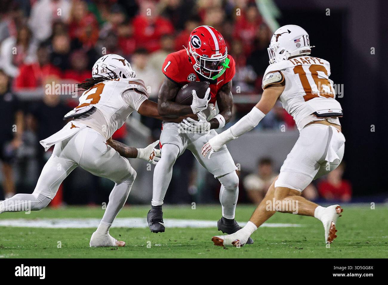 Georgia wide receiver Zachariah Branch, center, catches a pass during ...