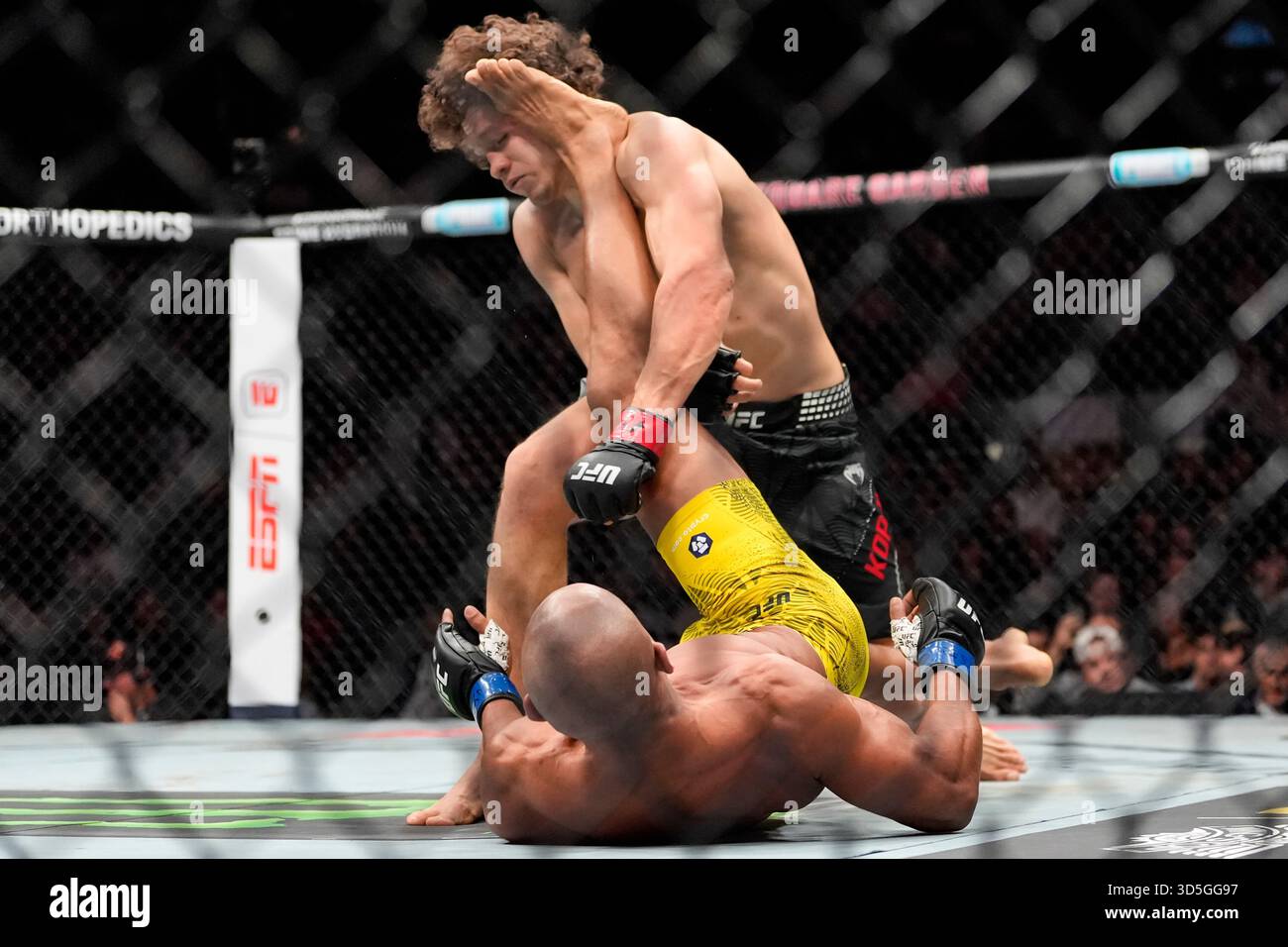 Russia's Roman Kopylov, top, grapples with Brazil's Gregory Rodrigues ...