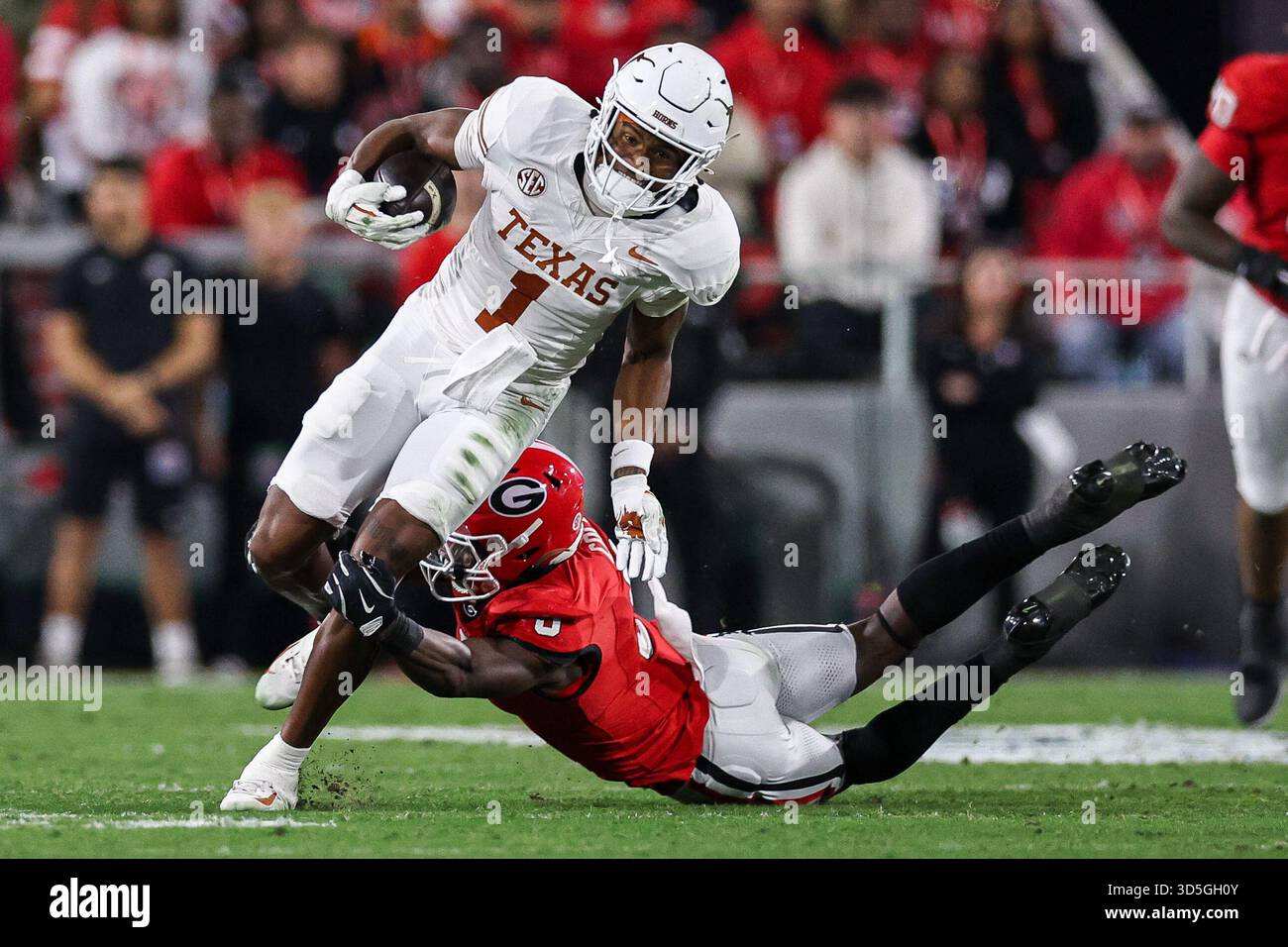 Texas wide receiver Ryan Wingo (1) is tackled by Georgia linebacker ...