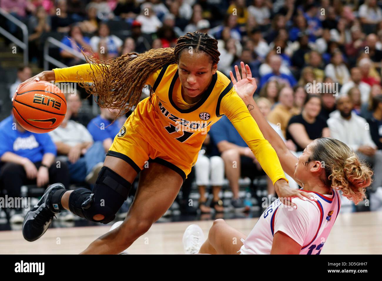 Missouri guard Jayla Smith (11) is fouled by Kansas guard Sania ...