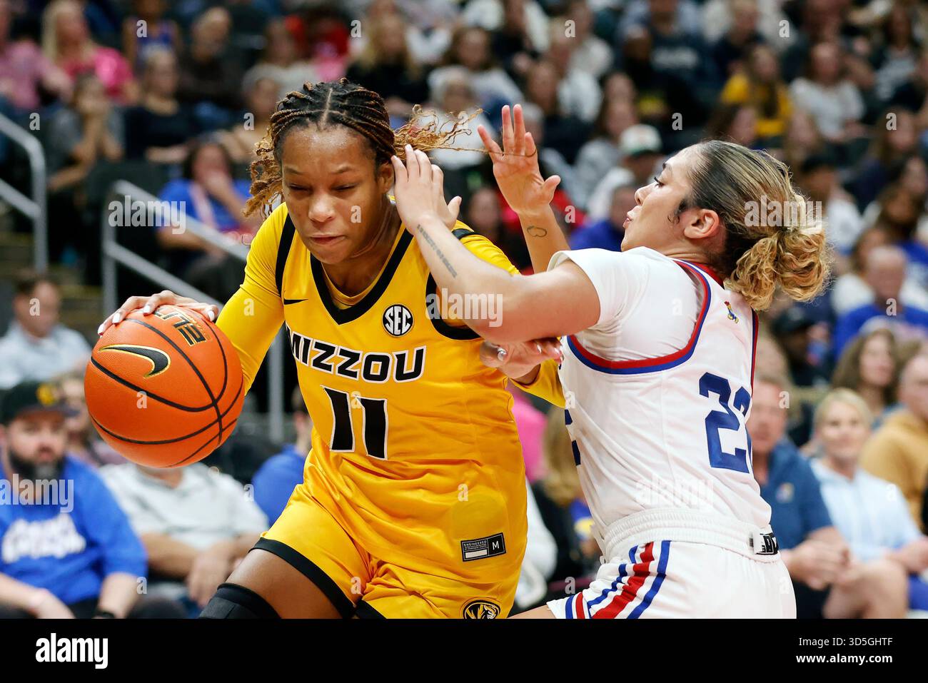 Missouri guard Jayla Smith (11) gets fouled by Kansas guard Sania ...