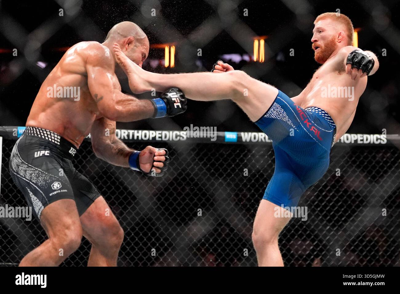 Bo Nickal, right, kicks Brazil's Rodolfo Vieira, left, during the third ...