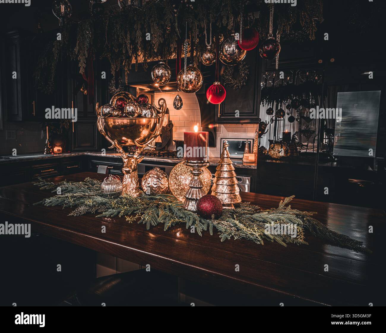 A modern Christmas kitchen decorated with warm holiday accents ...