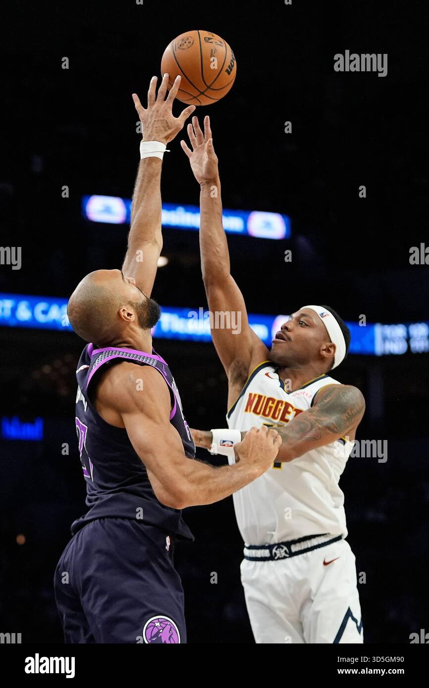 Denver Nuggets guard Bruce Brown, right, shoots over Minnesota ...