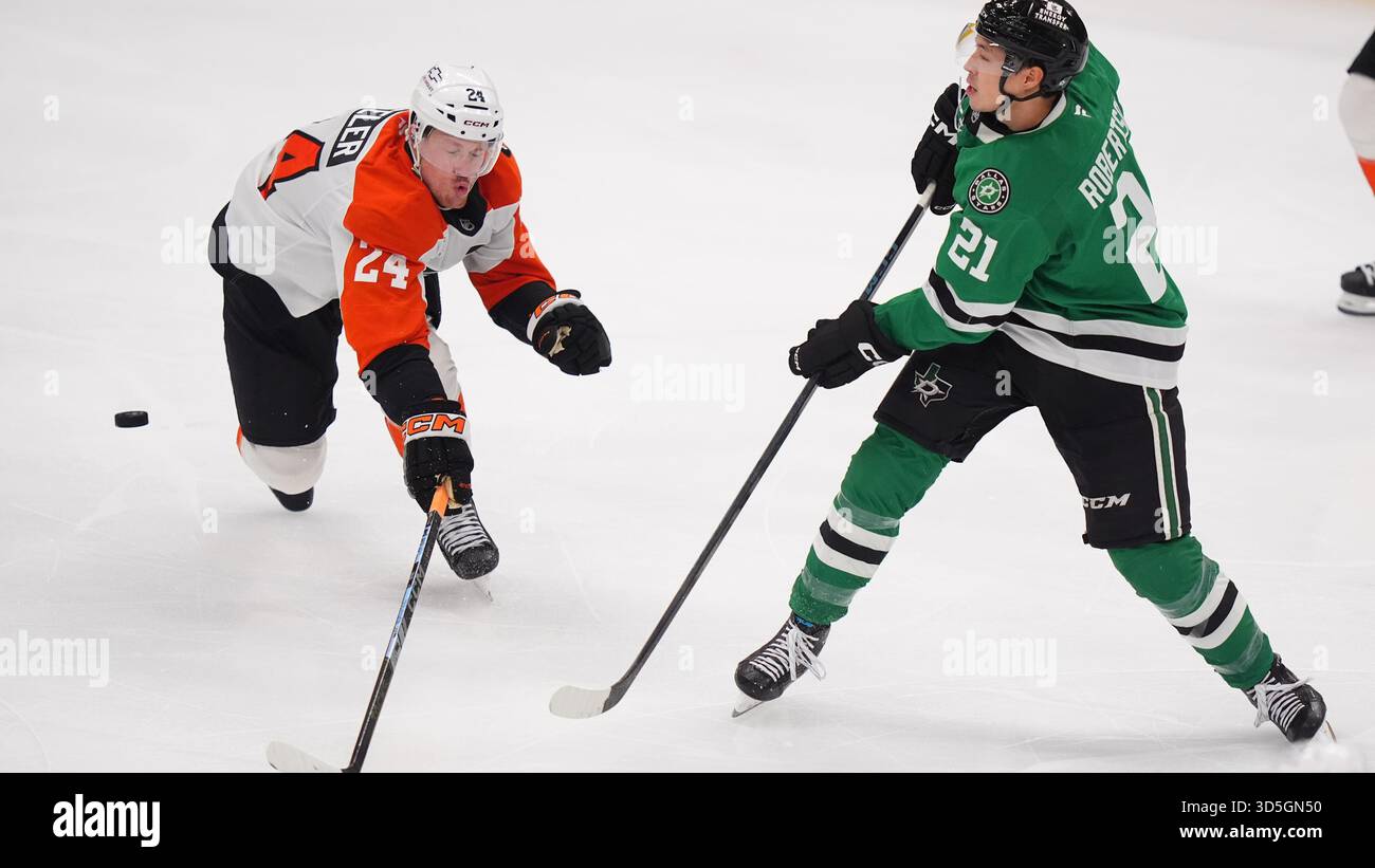 Dallas Stars left wing Jason Robertson (21) hits the puck past ...