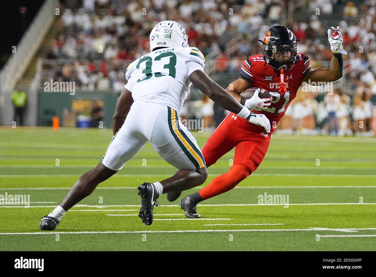 Utah running back Naquari Rogers, right, runs the ball on his way to a ...