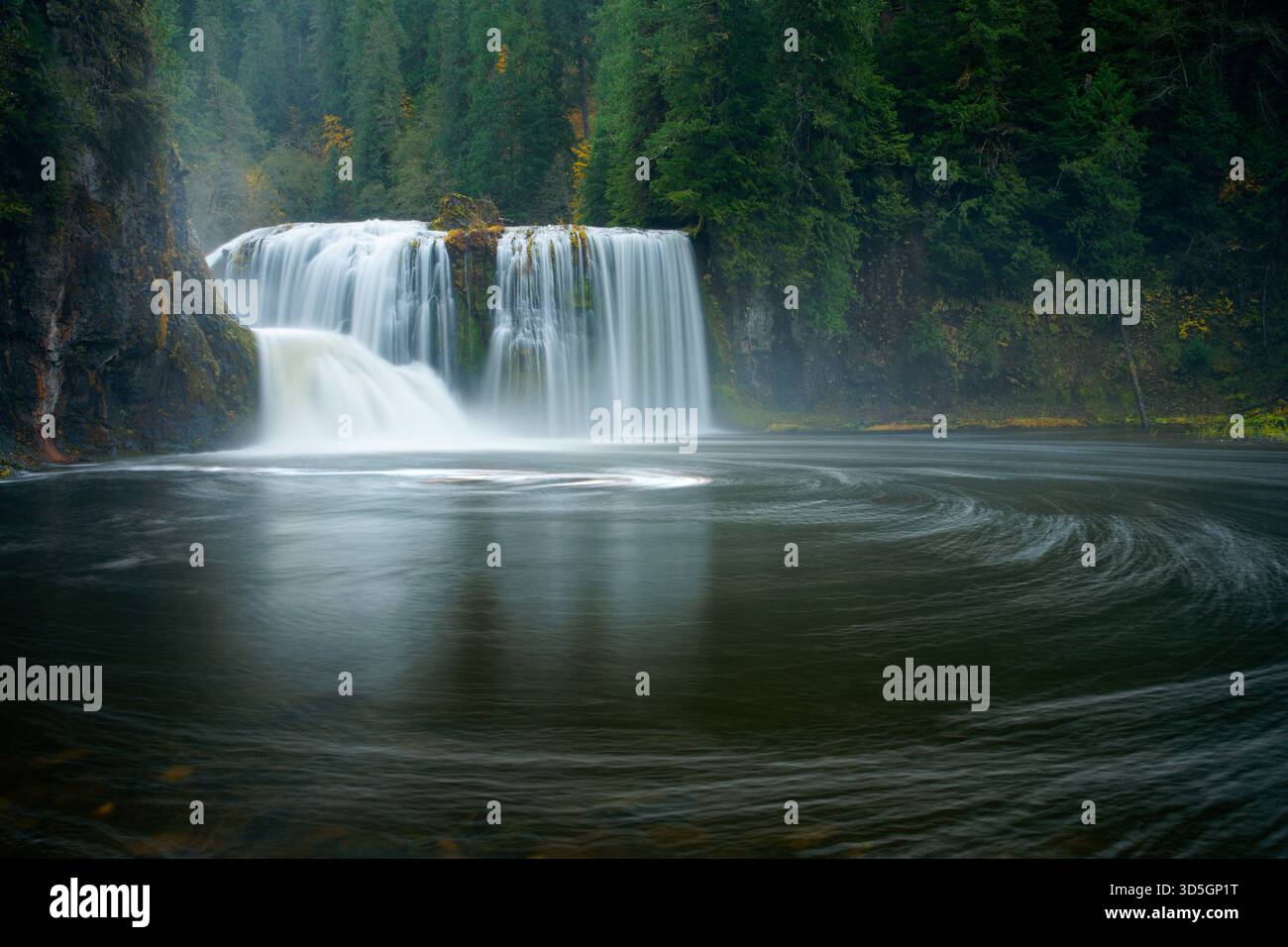 The Lewis River flows over the Upper Lewis River Falls in autumn ...