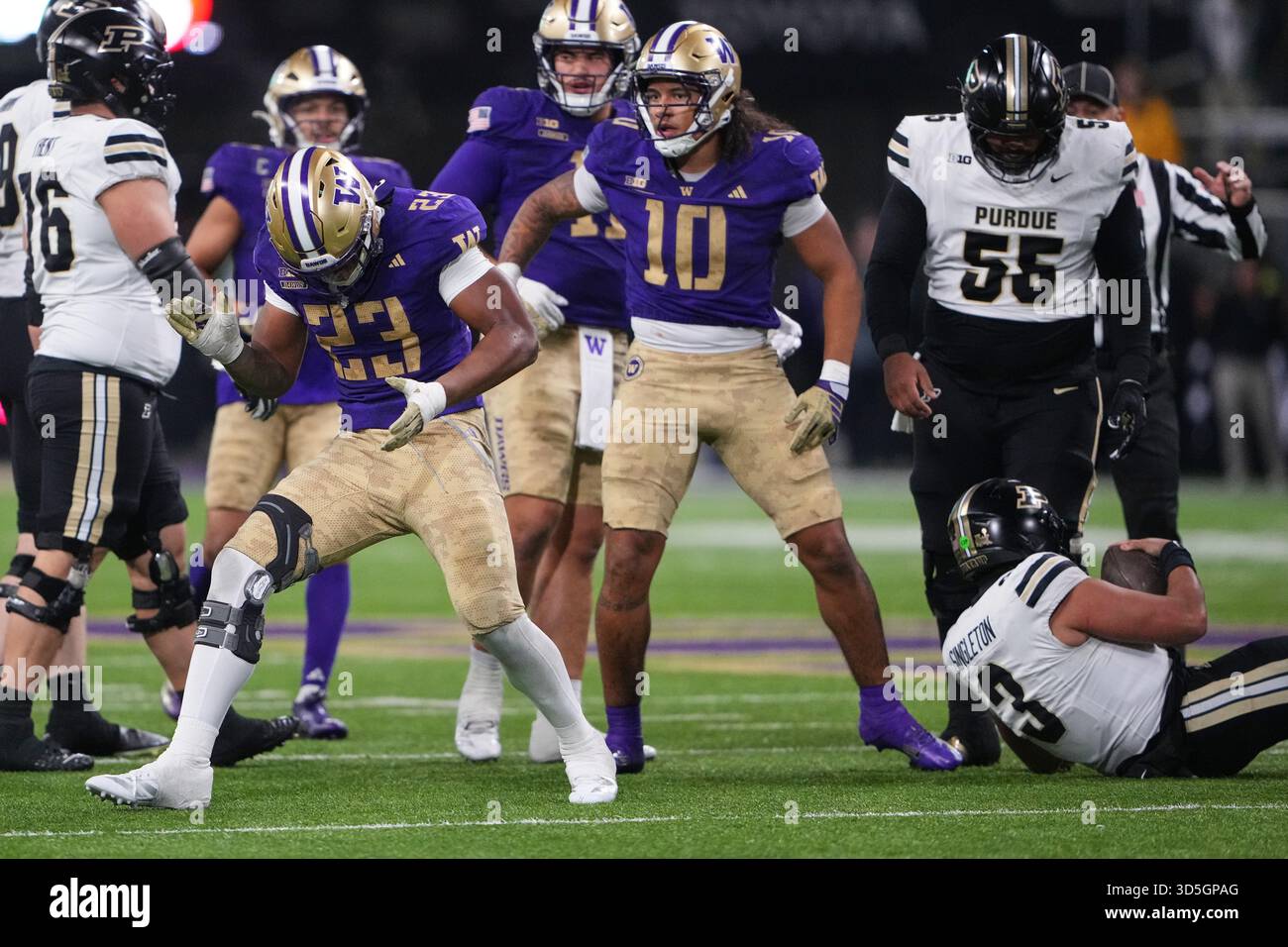 Washington linebacker Zaydrius Rainey-Sale (23) celebrates sacking ...