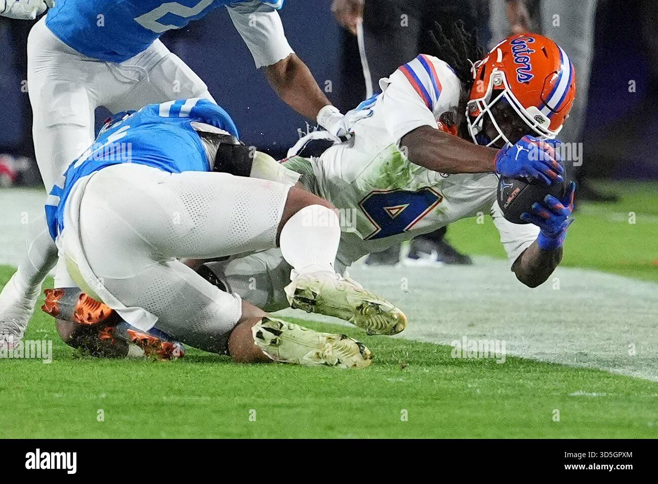 Florida wide receiver TJ Abrams (4) is tackled by a Mississippi player ...