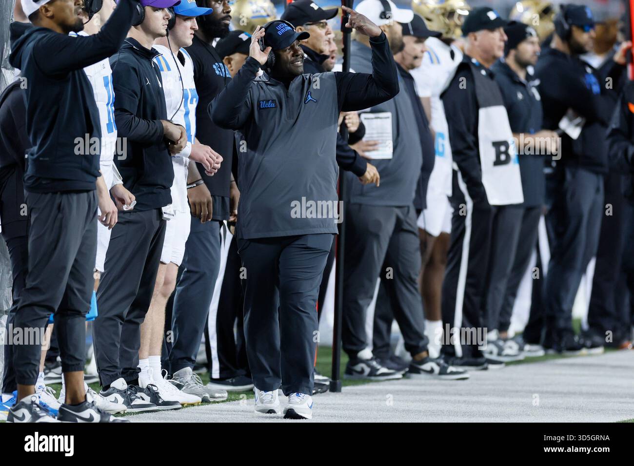 UCLA interim head coach Tim Skipper, center, signals to his team during ...
