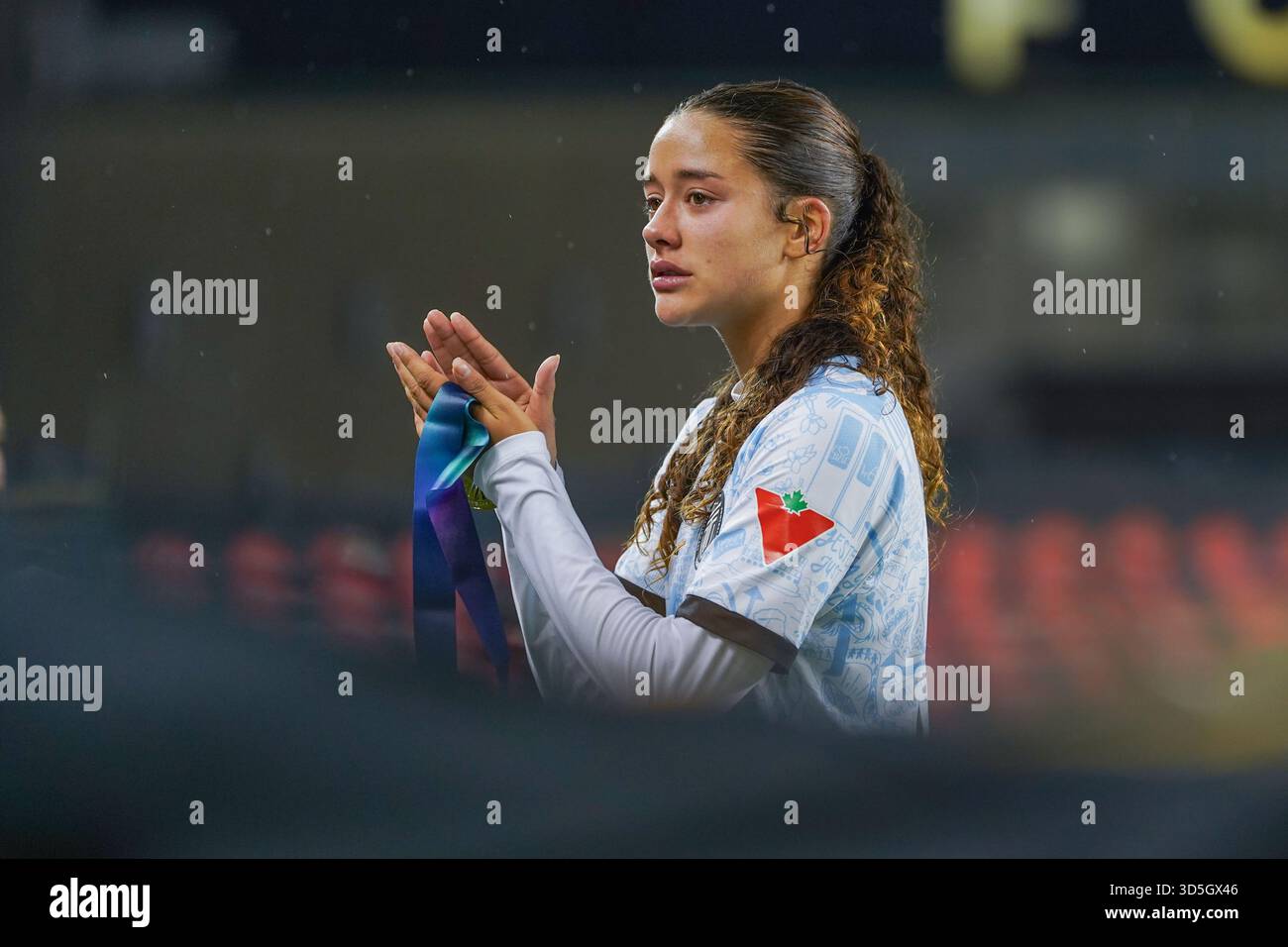 Sarah Rollins #14 of AFC Toronto receives second place medal during the ...