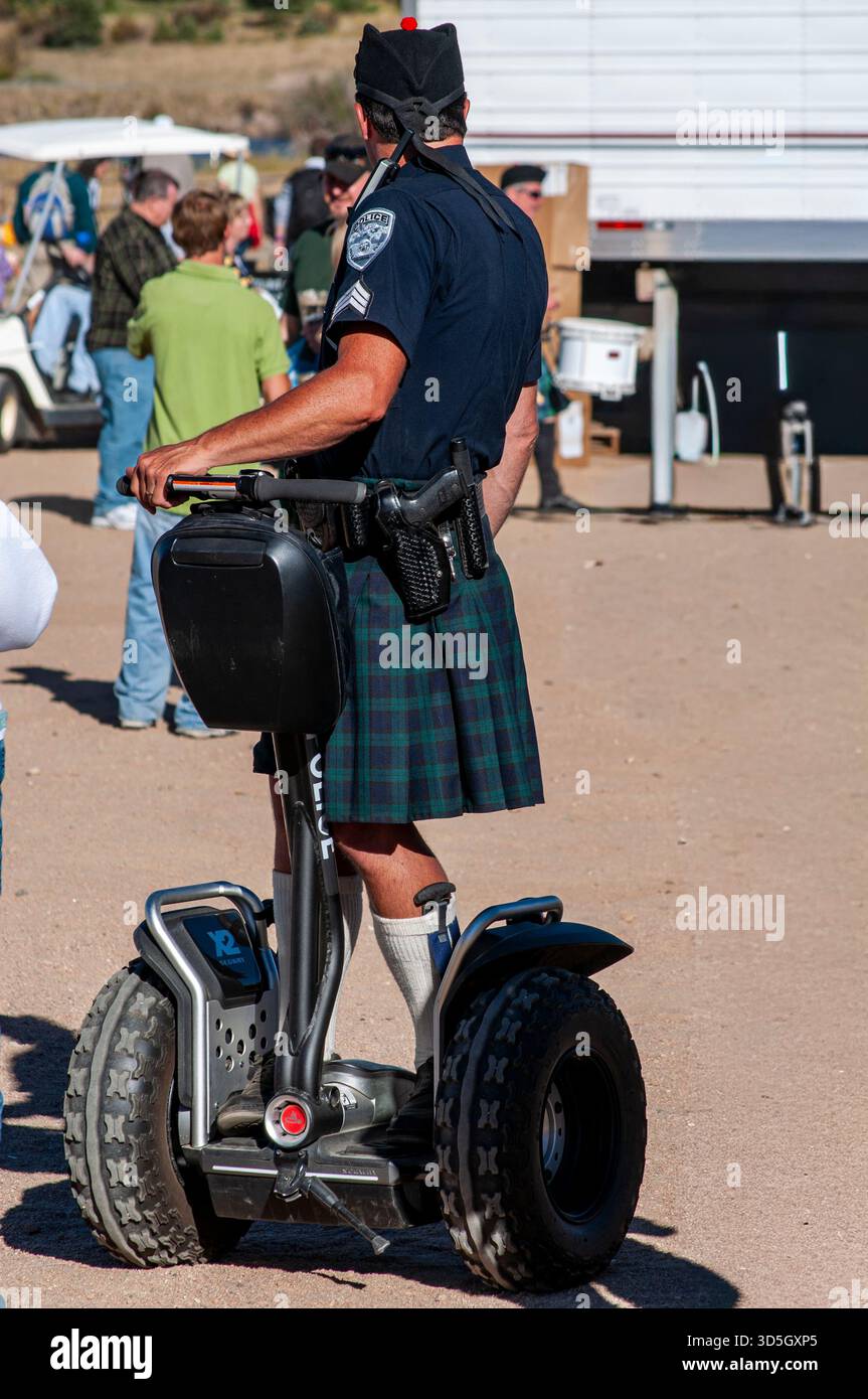 Uniformed Police Officer On Segway At Outdoor Community Event With ...