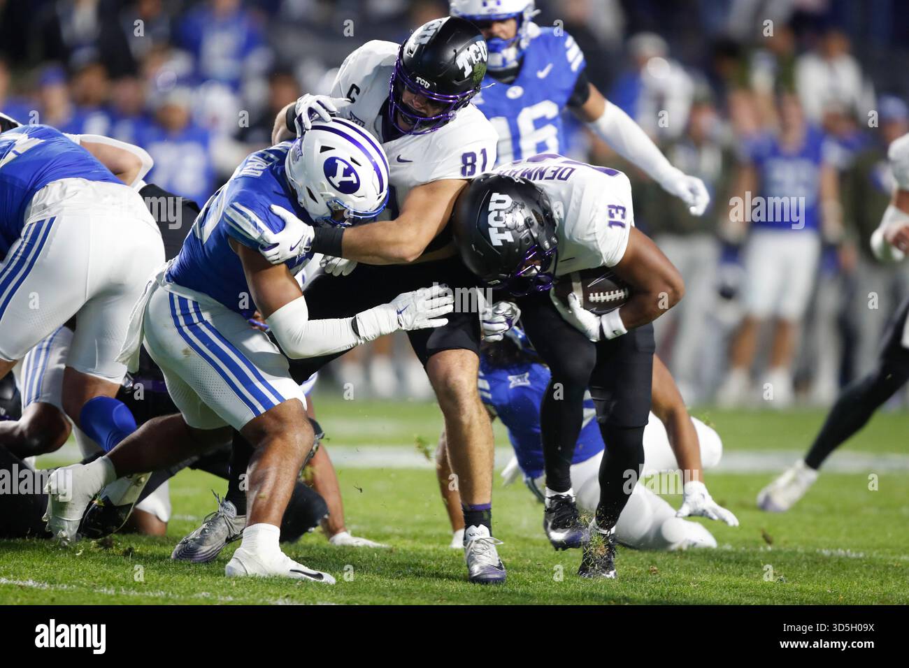 TCU running back Jon Denman (13) runs the ball as TCU tight end Chase ...