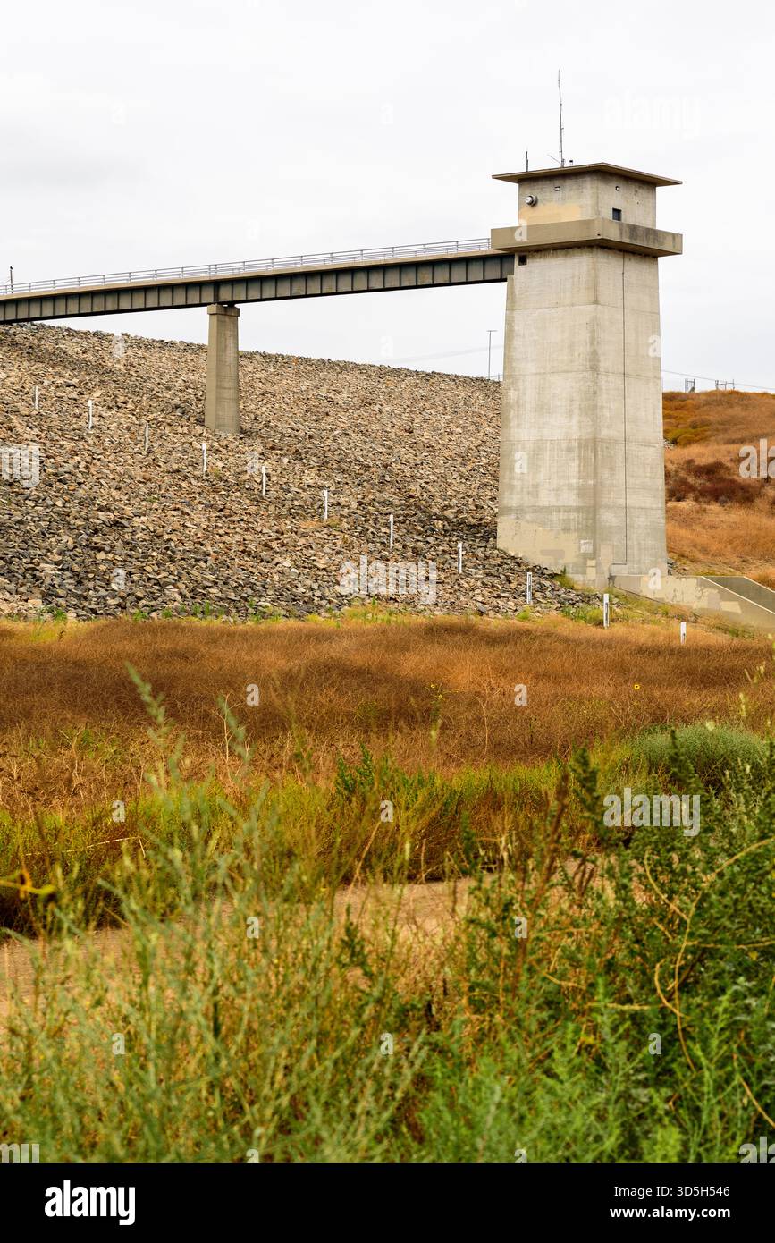 The tall concrete control tower elevated spillway stand on the rock ...