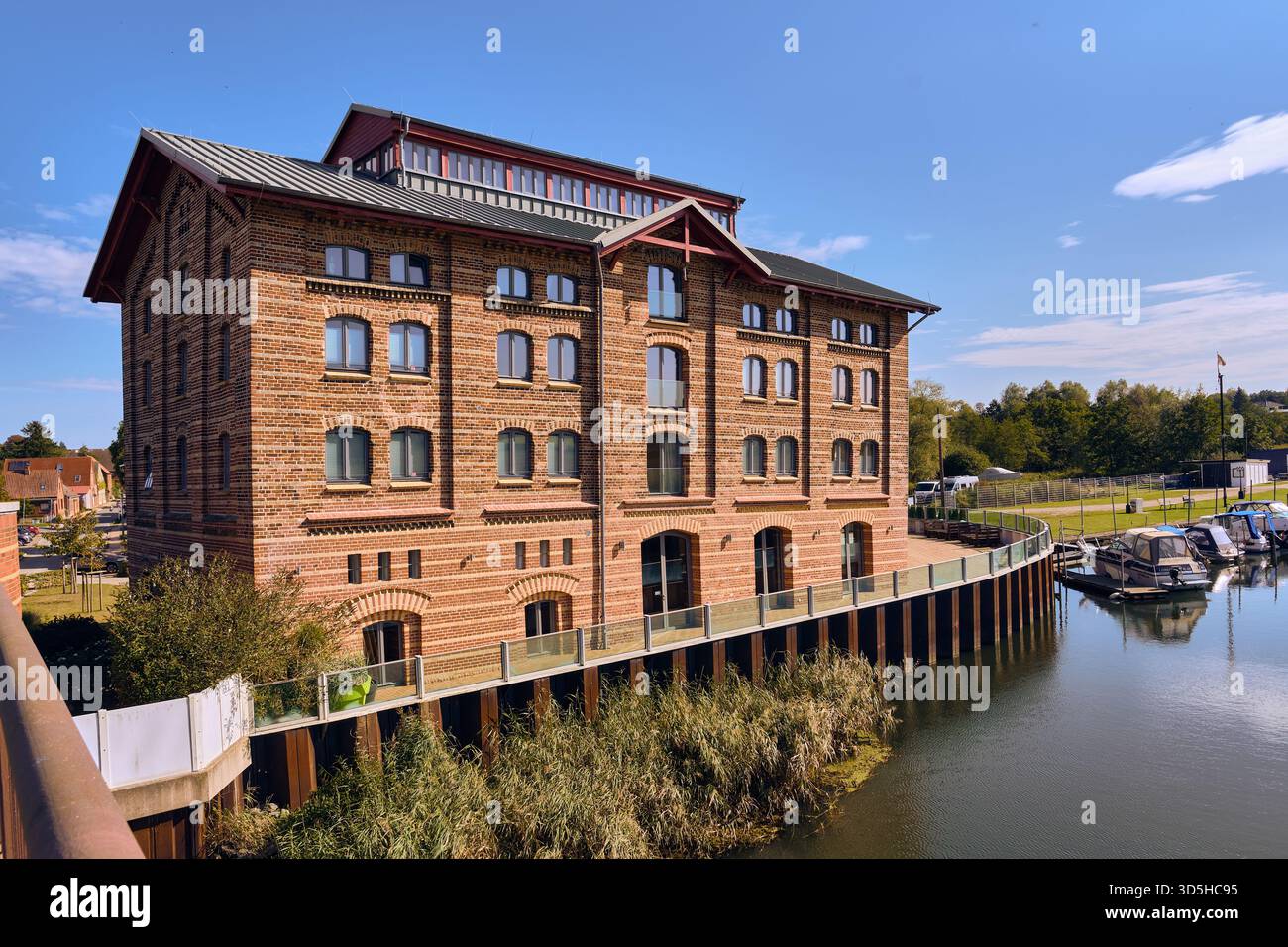 Dassow, Germany; September 27, 2025: Restored harbor warehouse ...