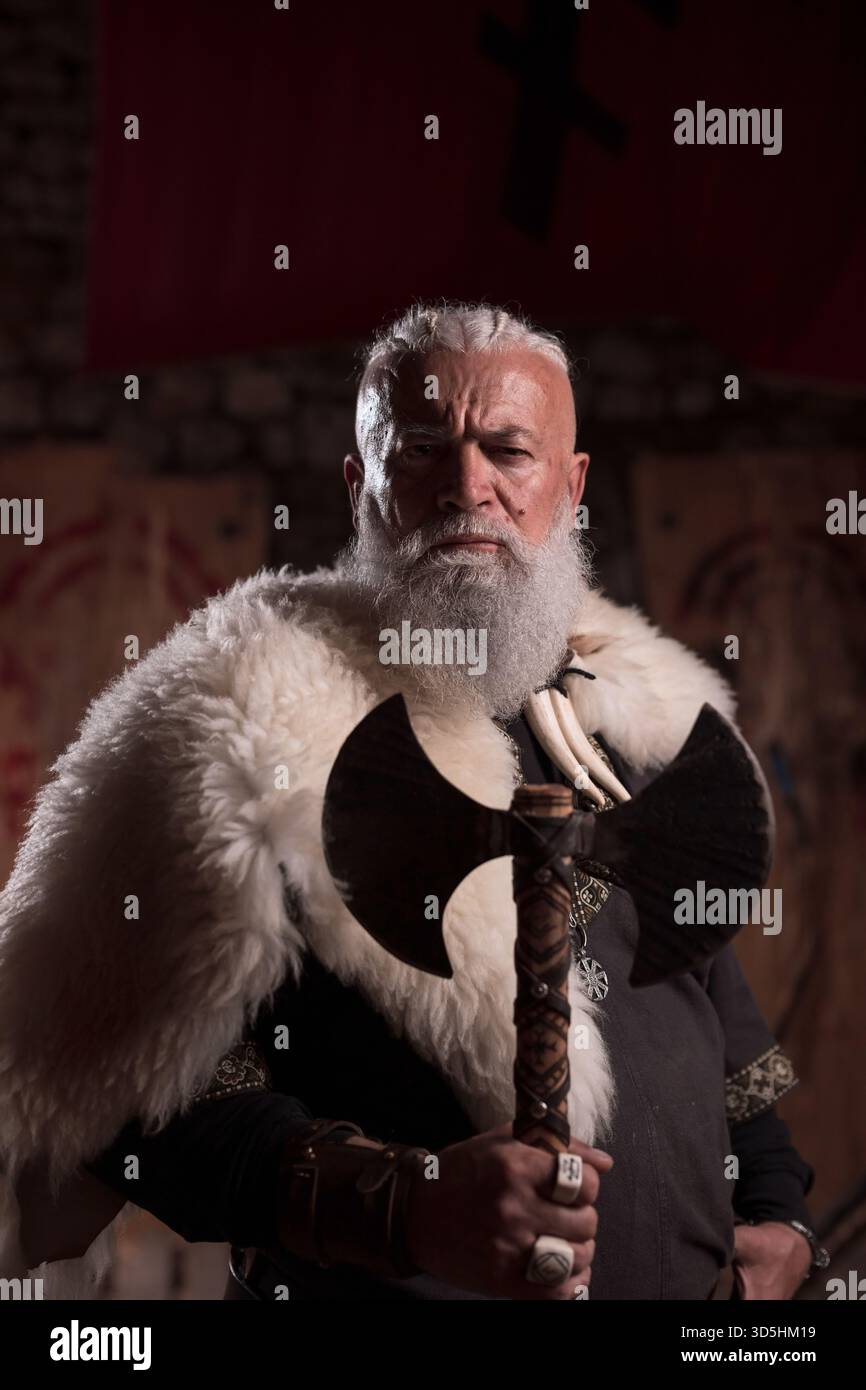 Rugged Viking warrior as a king or hero with a white beard, dressed in ...
