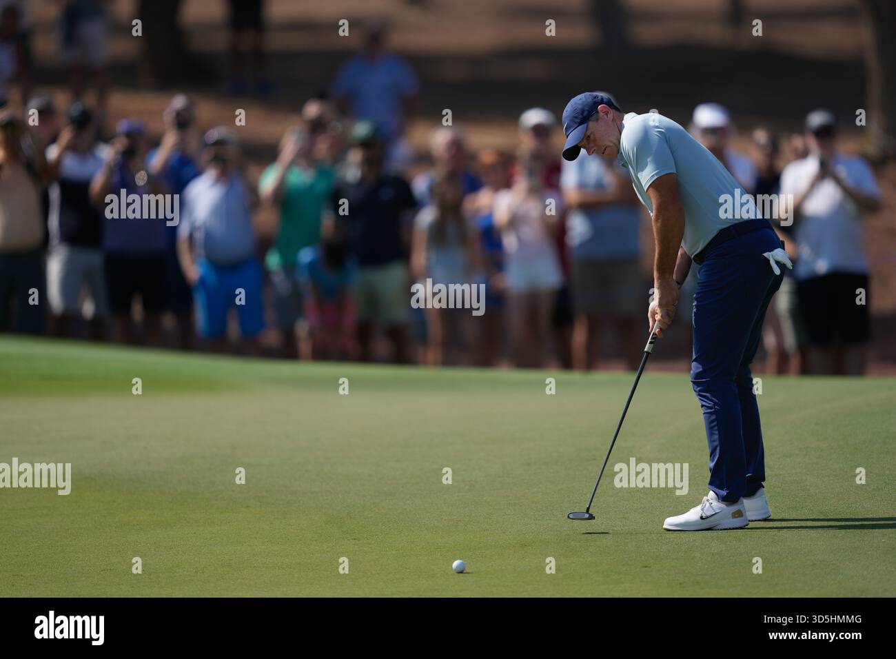 Rory McIlroy of Northern Ireland putts on the 1st green during the ...