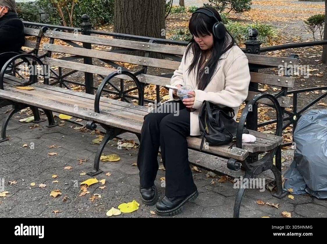 Reyna Dominguez, 18, reads in Union Square Park in Manhattan on Nov. 6 ...