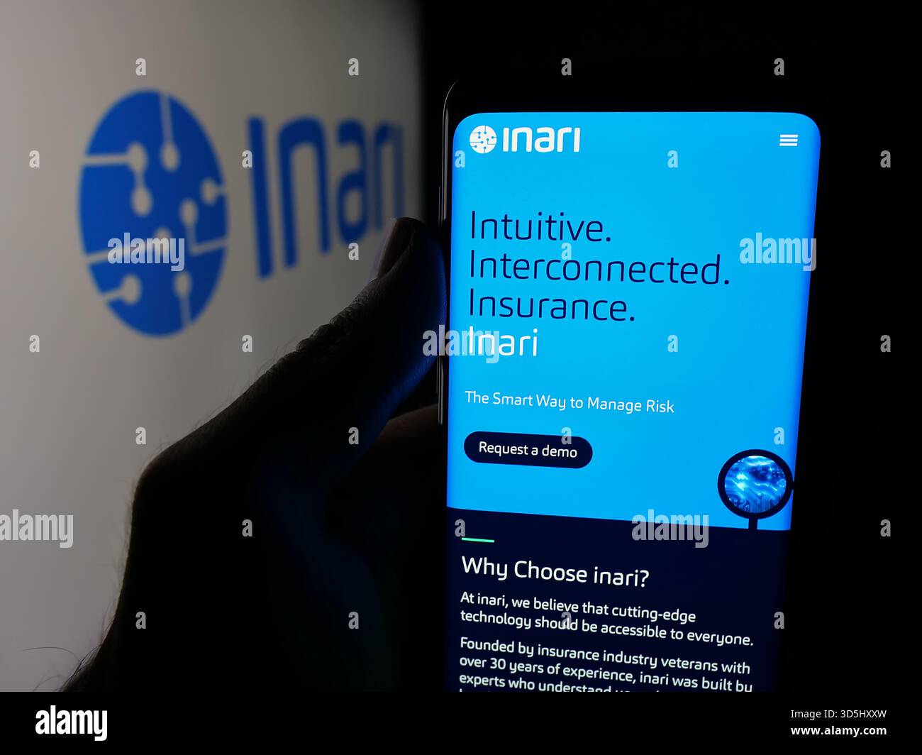 In this photo illustration, a person is holding a cellphone with the ...