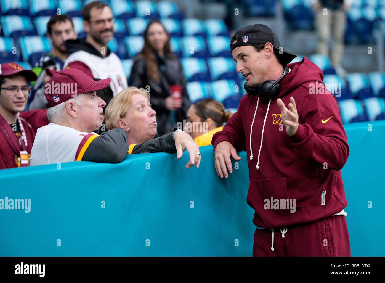 Washington Commanders punter Tress Way (10) speaks to spectator as he ...