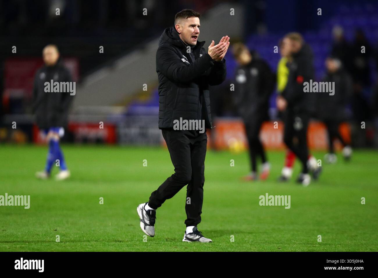 Lee Bell, Manager of Crewe Alexandra applauds the fans following a 0-0 ...