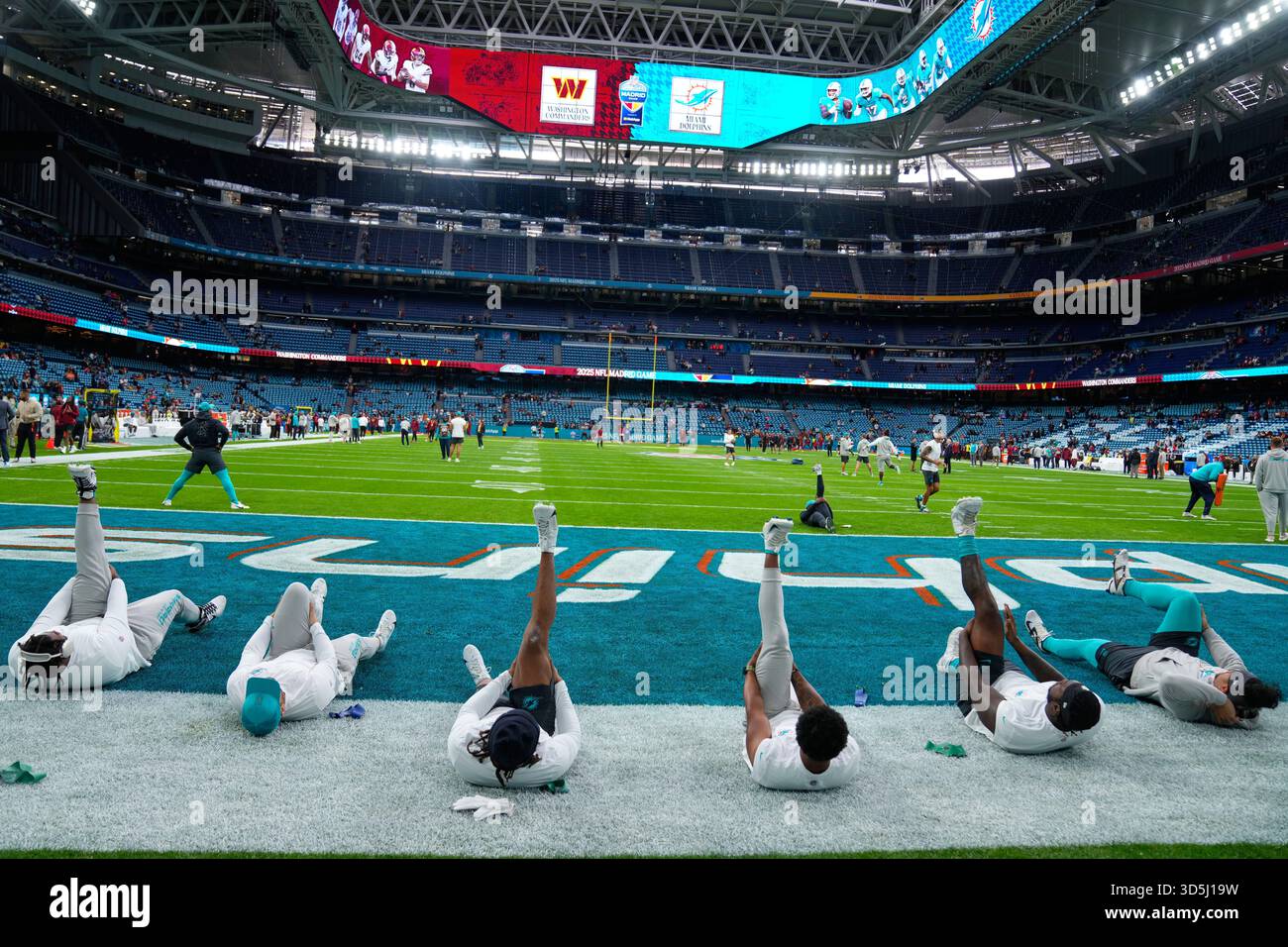 Miami Dolphins players warm-up inside the Santiago Bernabeu Stadium ...