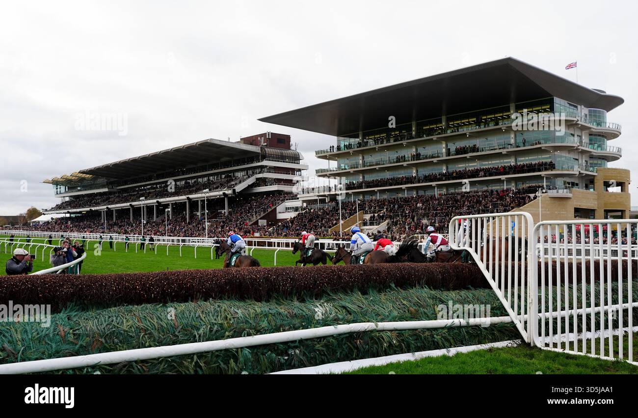 Runners and riders pass the grand stand as they take part in the ...