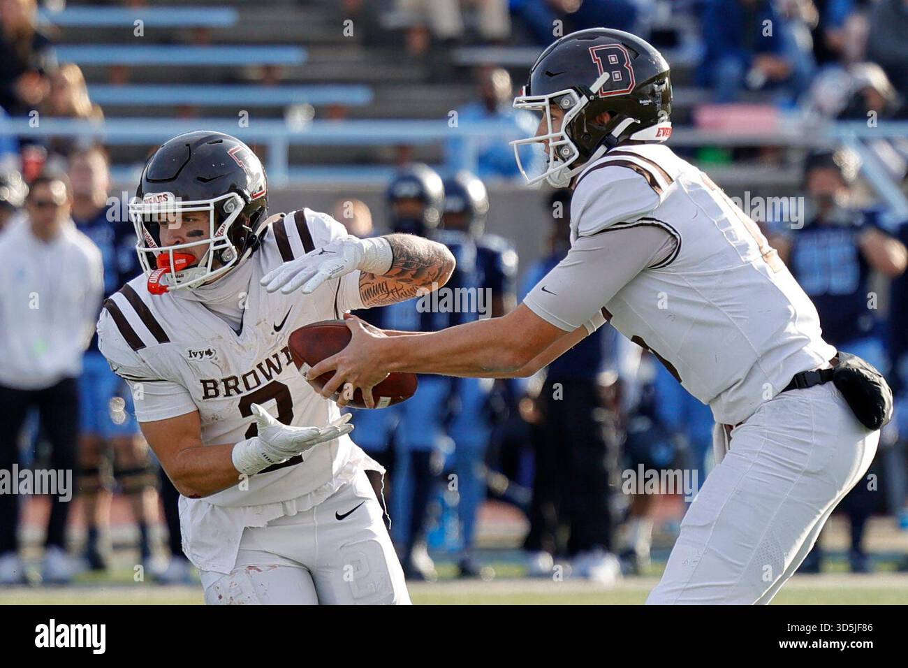 Brown quarterback James Murphy (15) hands the ball off during an NCAA ...