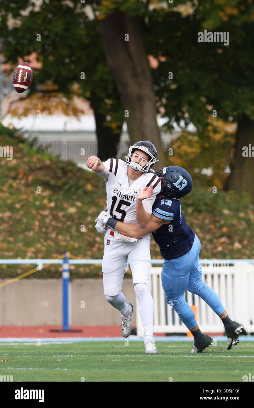 Brown quarterback James Murphy (15) gets tackled during an NCAA ...